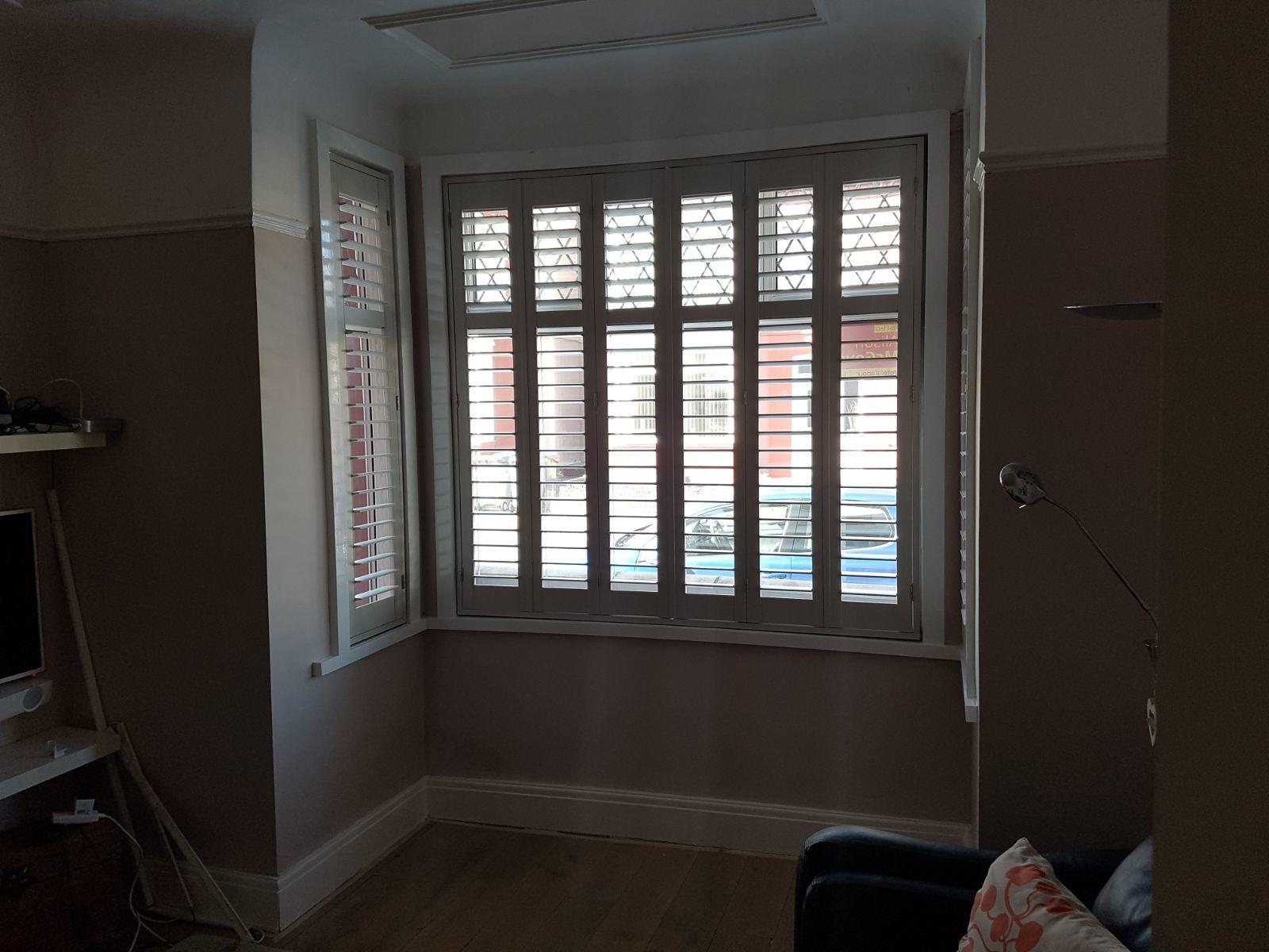 A square bay window shutter installation | Absolute Shutters